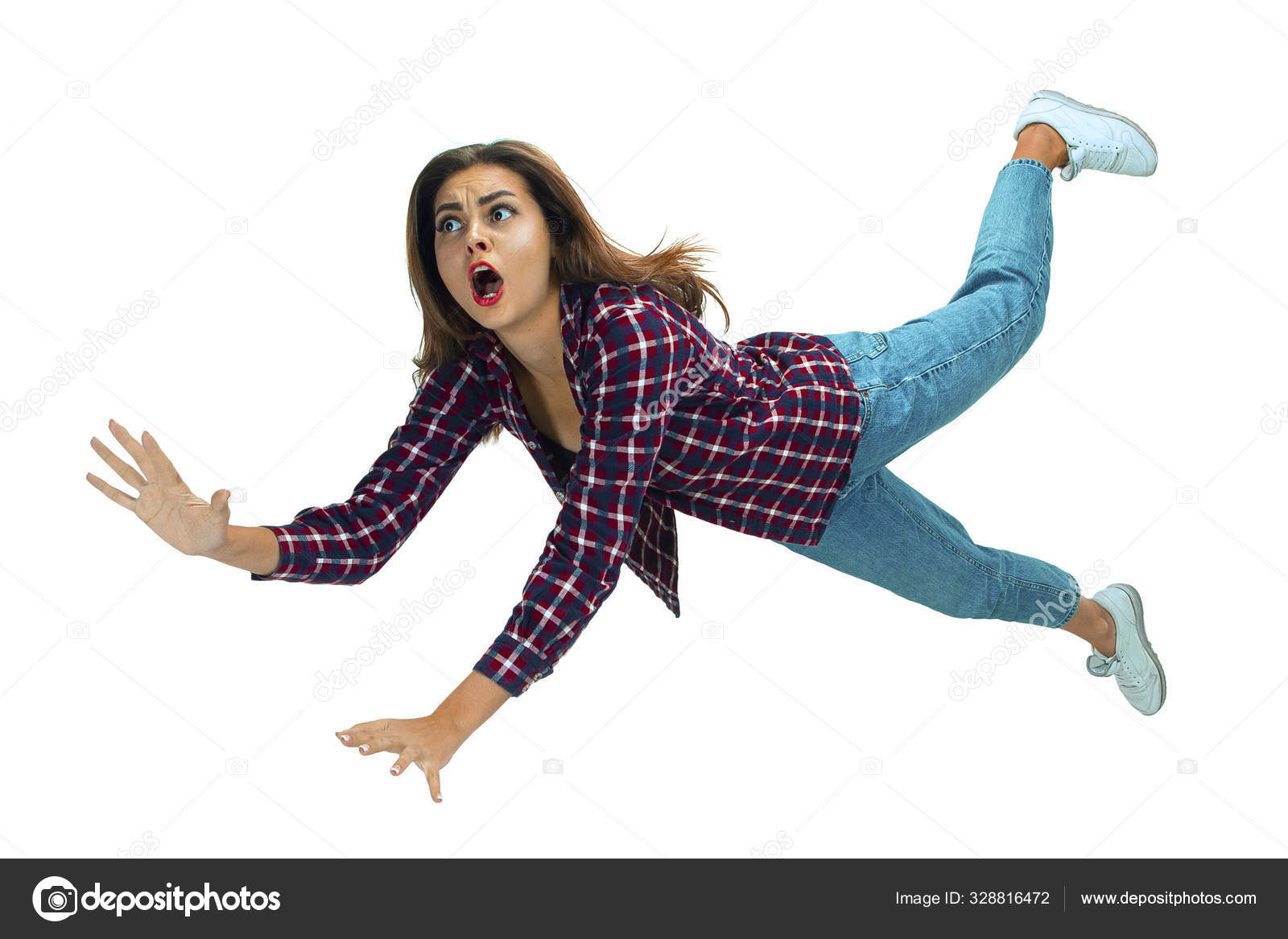 A second before falling - young girl falling down with bright emotions ...