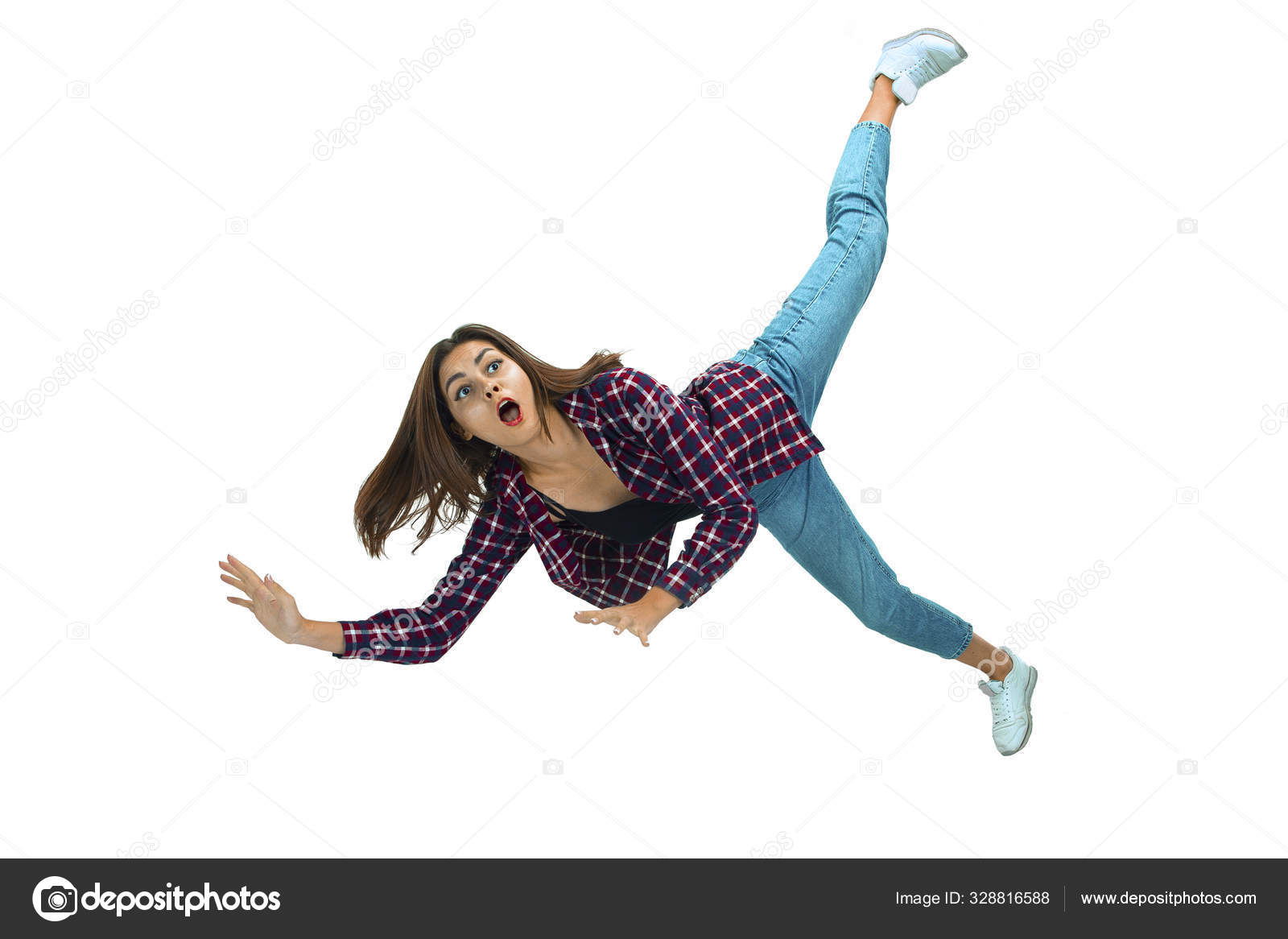 A second before falling - young girl falling down with bright emotions ...