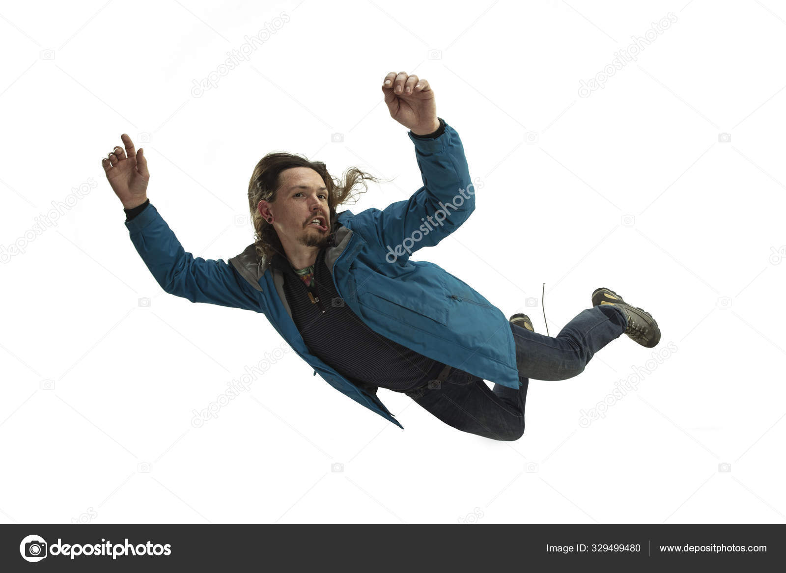 A second before falling - young man falling down with bright emotions ...