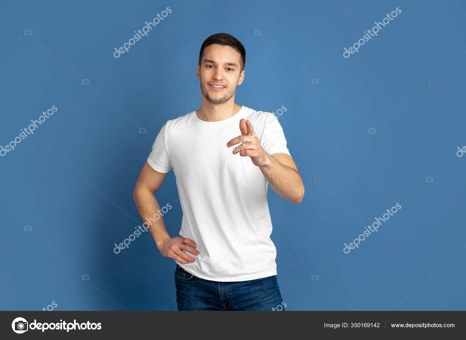 Caucasian young mans portrait on blue studio background — Stock Photo ...