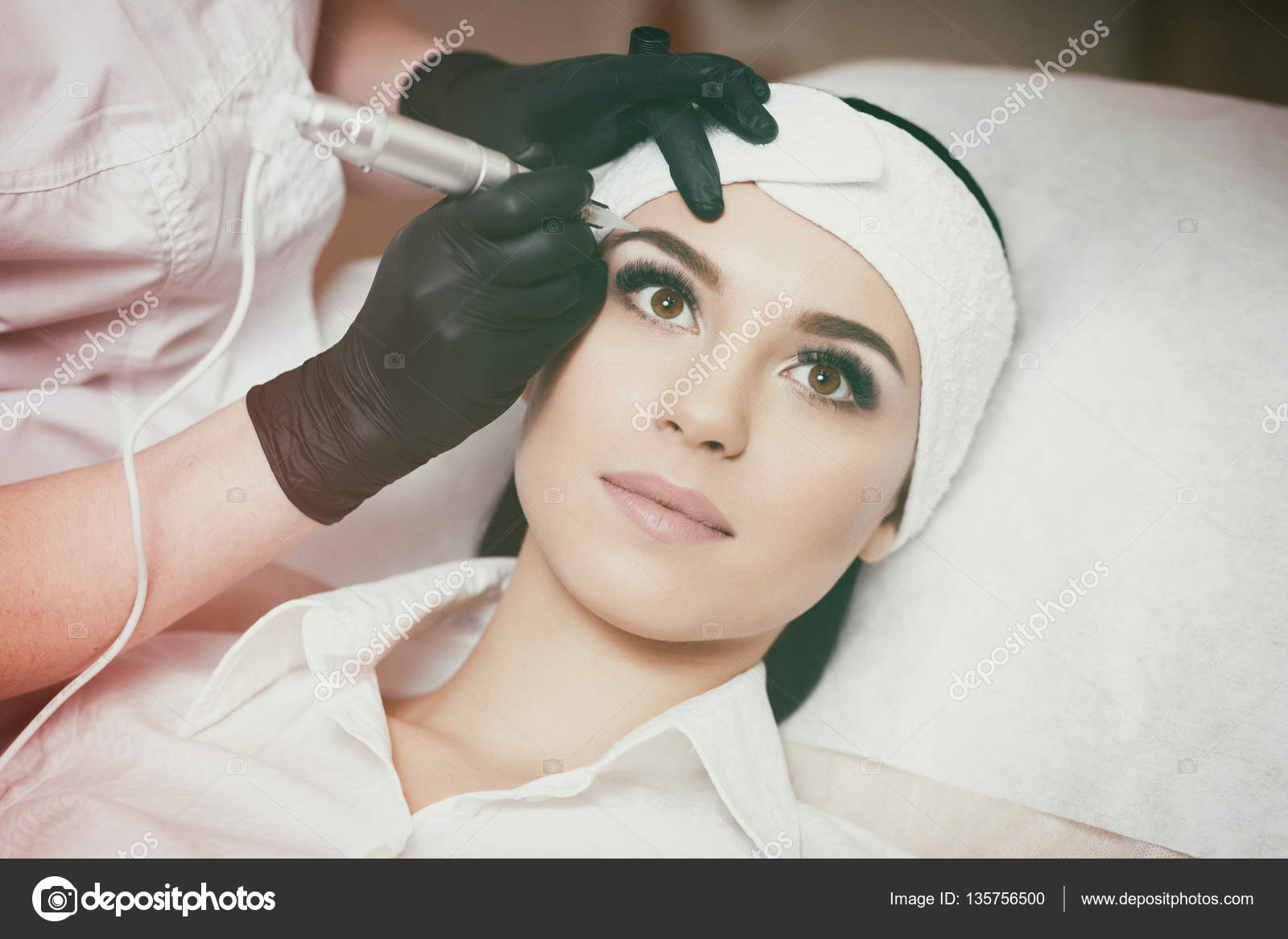 Permanent makeup. Tattooing of eyebrows Stock Photo by ©lyashik 135756500