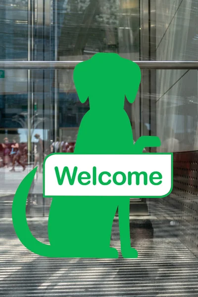 Dogs Welcome sign outside shop. Green dog-friendly sign. Welcome sign ...