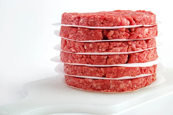 Raw burger patties Stock Photo by ©arskajuhani 88095214
