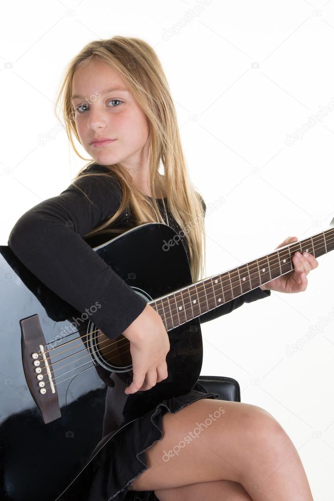 Young blond girl playing guitar isolated in white Stock Photo by ...