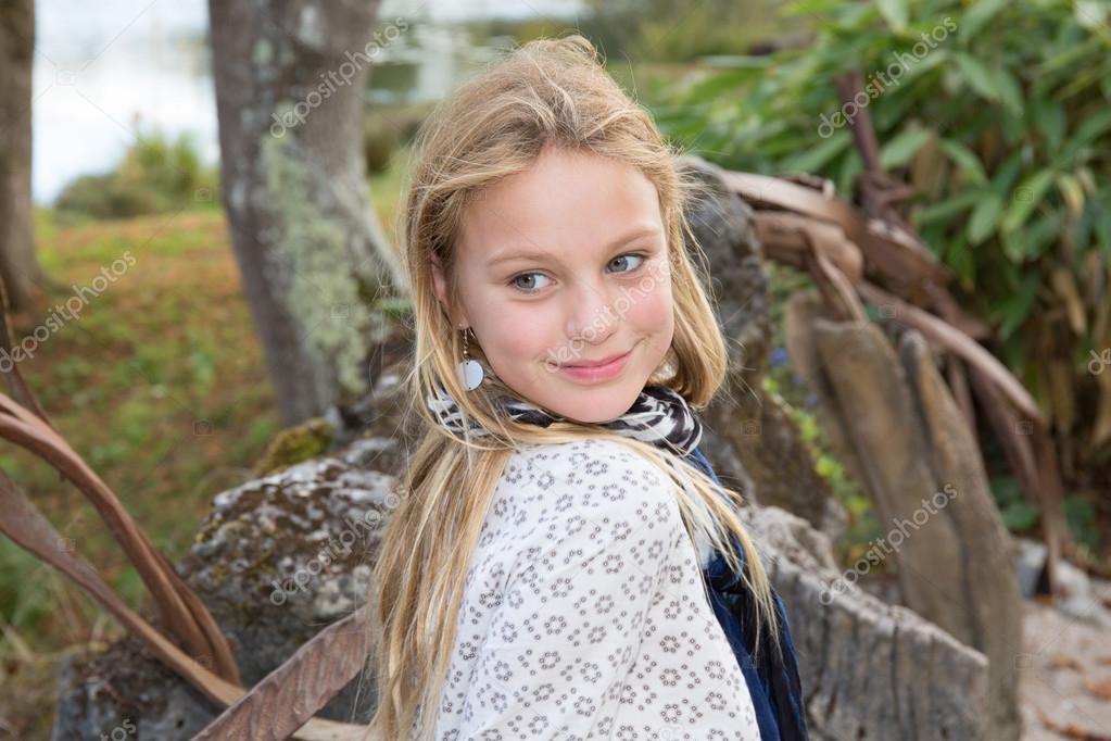 Pretty blonde teen girl smiling in grass Stock Photo by ©OceanProd ... Pretty blonde teen girl smiling in grass Stock Photo by ©OceanProd ...