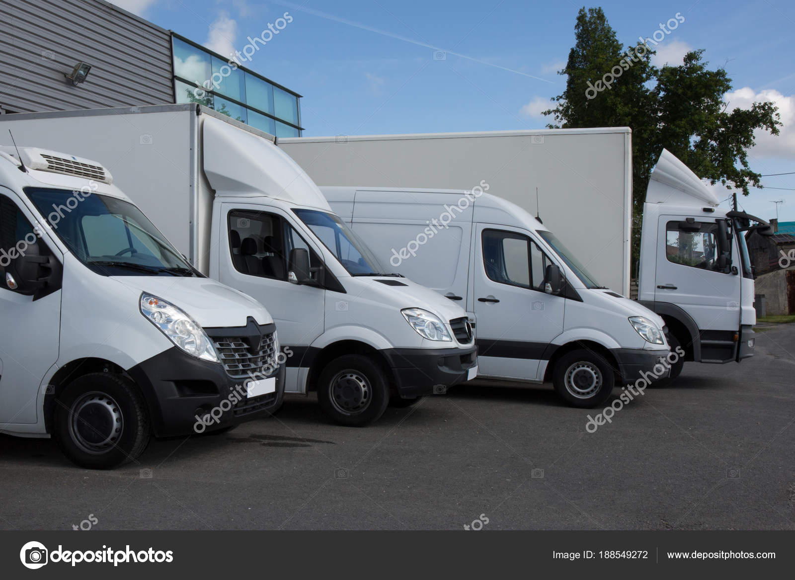 Row White Delivery Service Van Trucks Cars Front Factory Warehouse ...