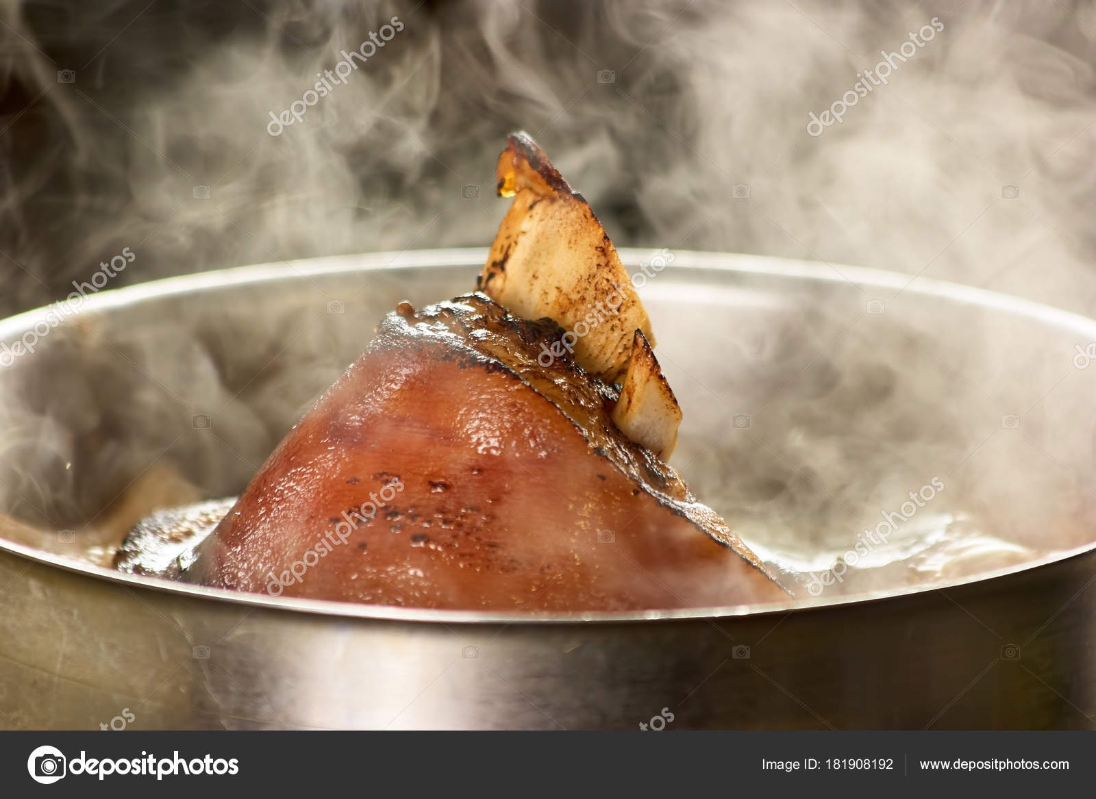 Roasted pork boiling in saucepan. Stock Photo by ©Denisfilm 181908192
