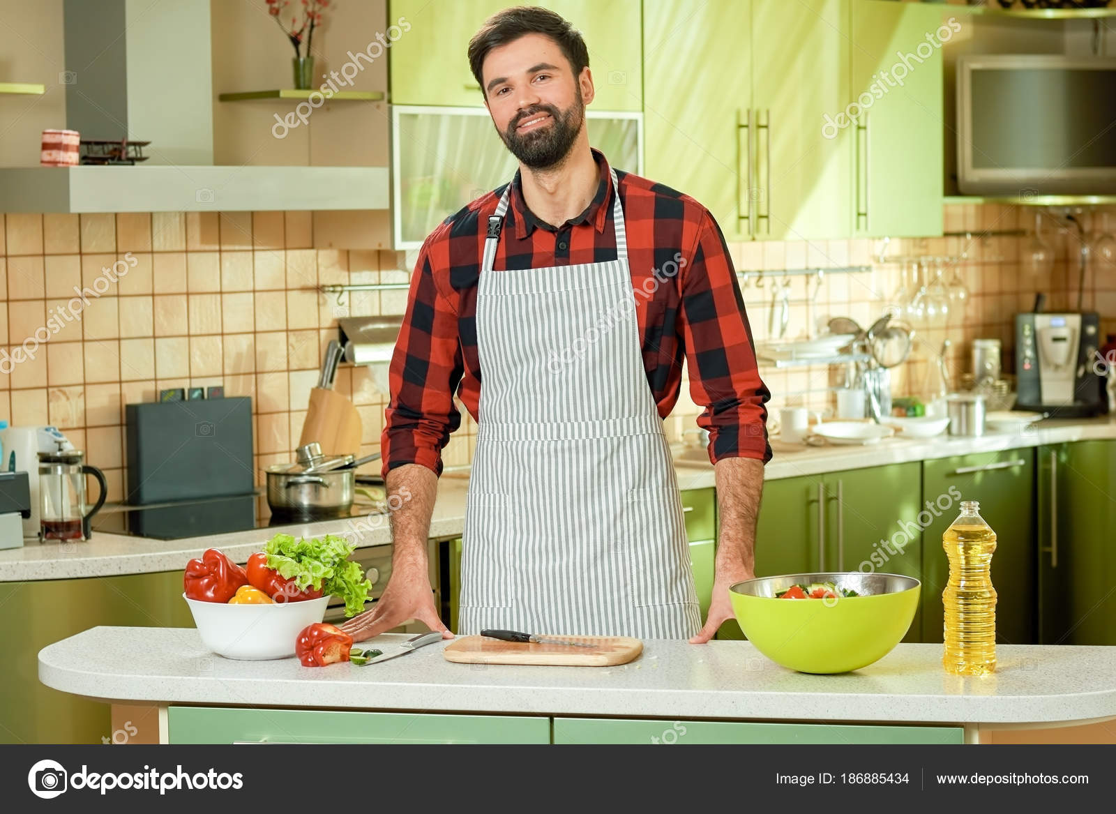 Young man in the kitchen. Stock Photo by ©Denisfilm 186885434