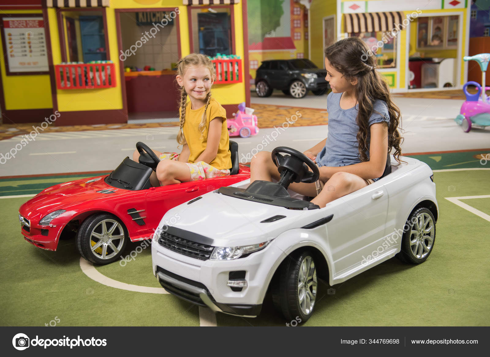 Kids driving mini toy car in game center. — Stock Photo © Denisfilm ...