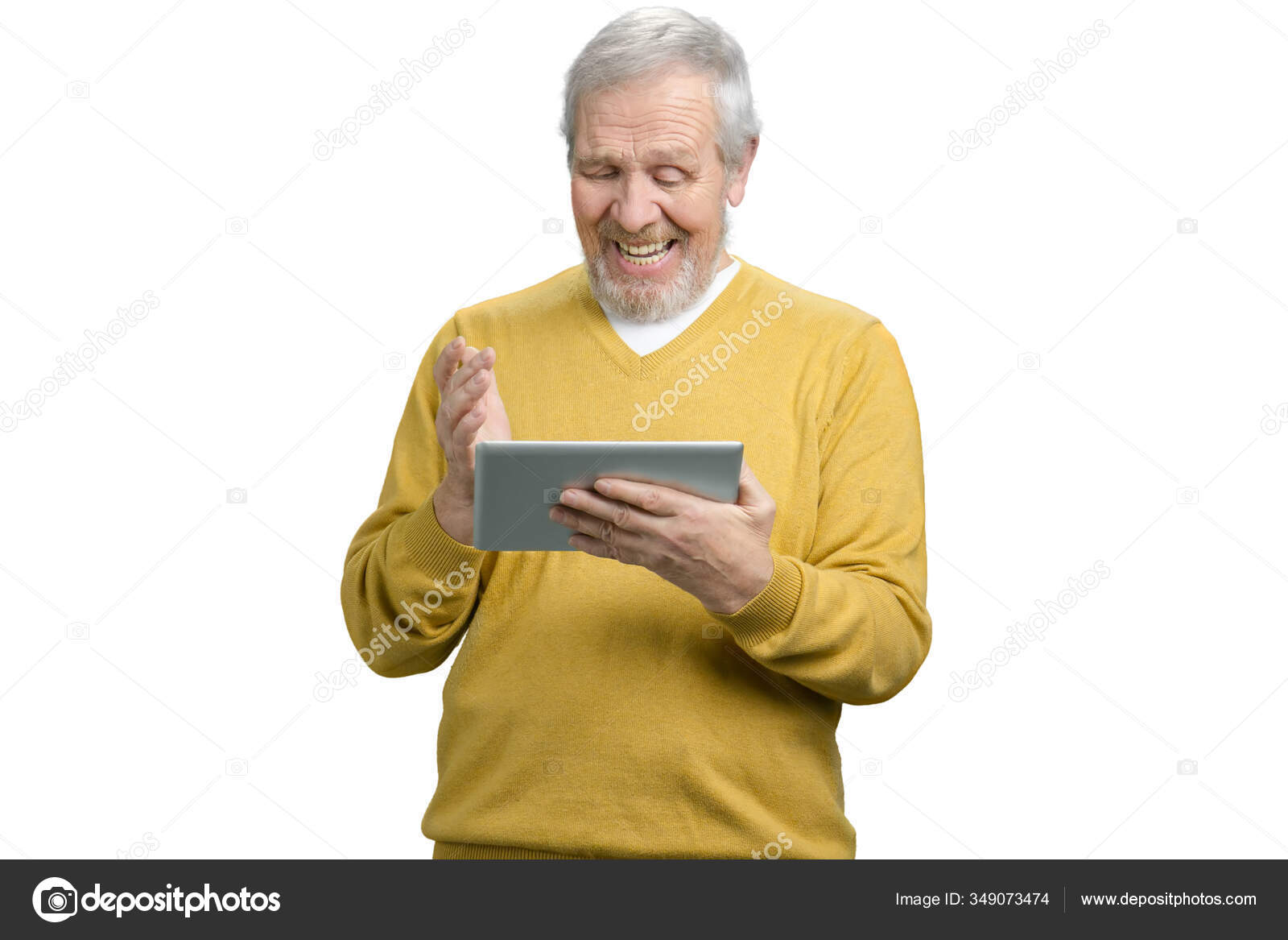 Old grandpa watching videos on tablet. Stock Photo by ©Denisfilm 349073474