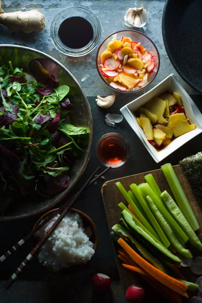 Wok, rice and vegetables for cooking sushi top view. Asian cuisine ...