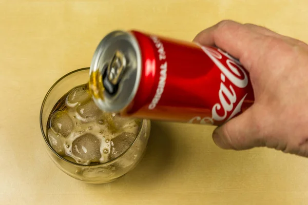 Pouring Pepsi from a can into a glass with ice cubes. – Stock Editorial ...