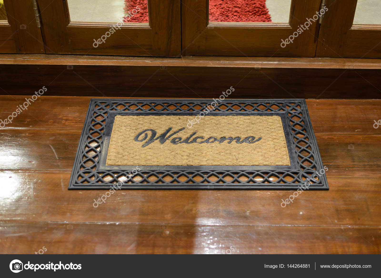 Welcome foot wipes on a porch Stock Photo by ©bigy00 144264881