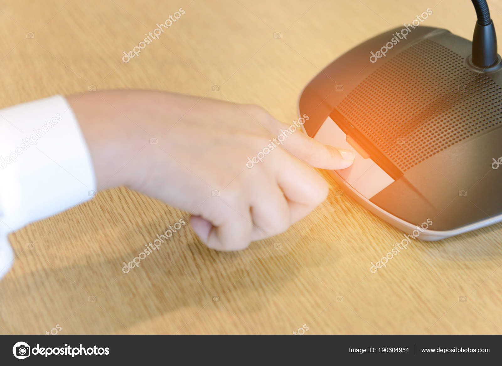 Businesswomen push switch on microphone to talk in meeting room — Stock ...
