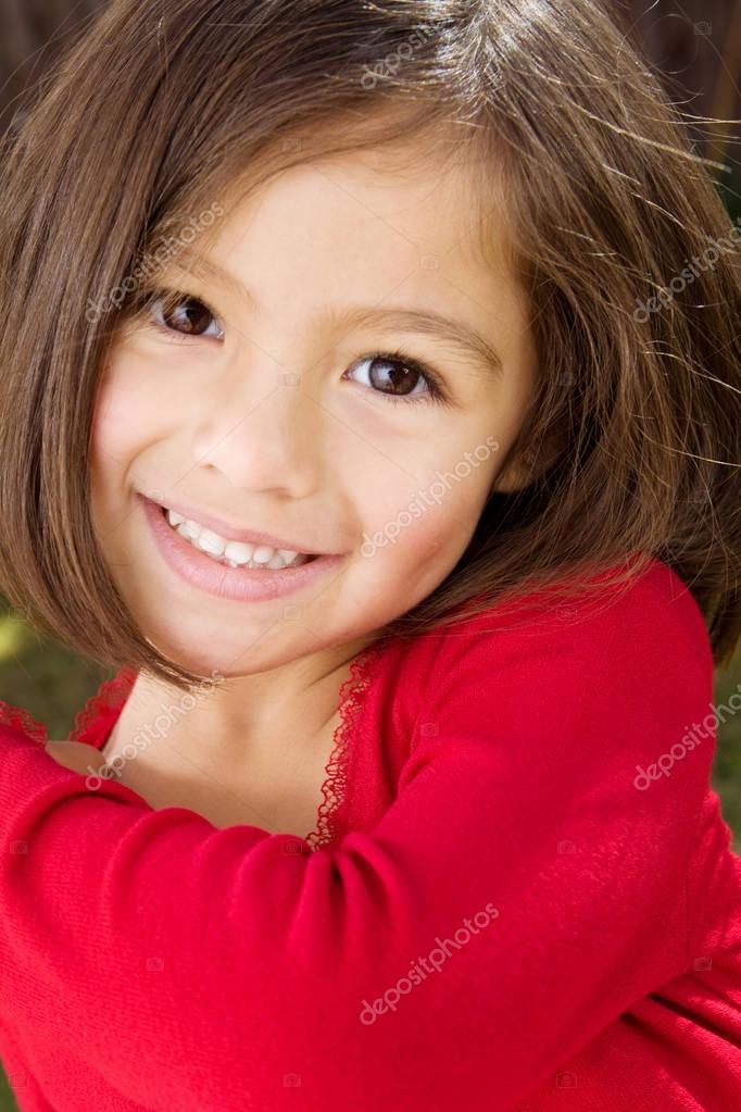 Portrait of a happy Hispanic little girl smiling. — Stock Photo ... Portrait of a happy Hispanic little girl smiling. — Stock Photo ...
