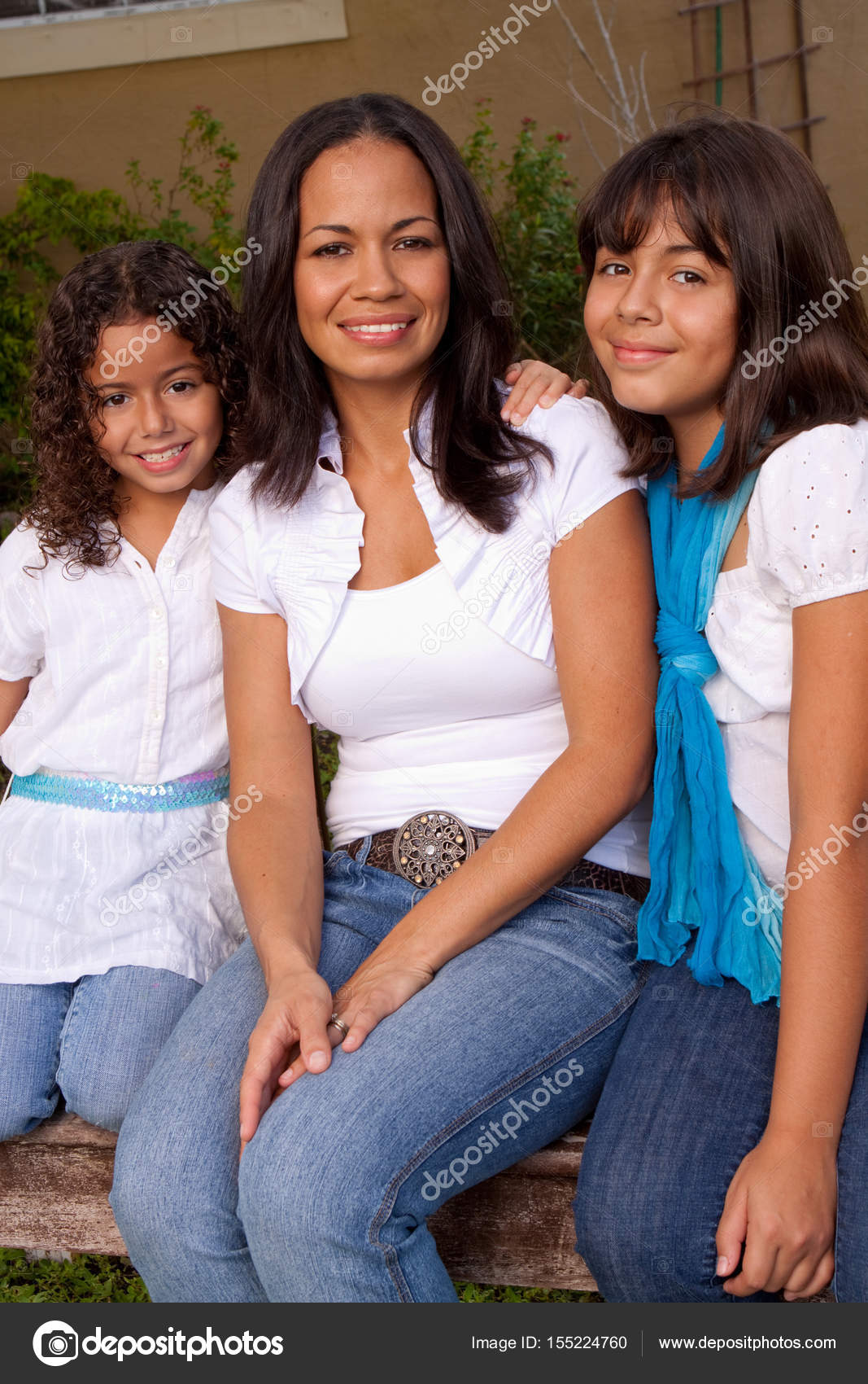 Happy Hispanic mother and daughters smiling. Stock Photo by ... Happy Hispanic mother and daughters smiling. Stock Photo by ...