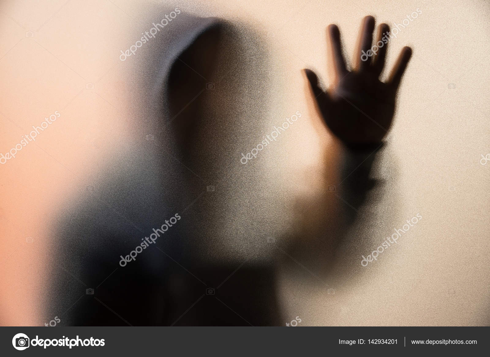 Shadow blur of horror man in jacket with hood.One hands on the g ...