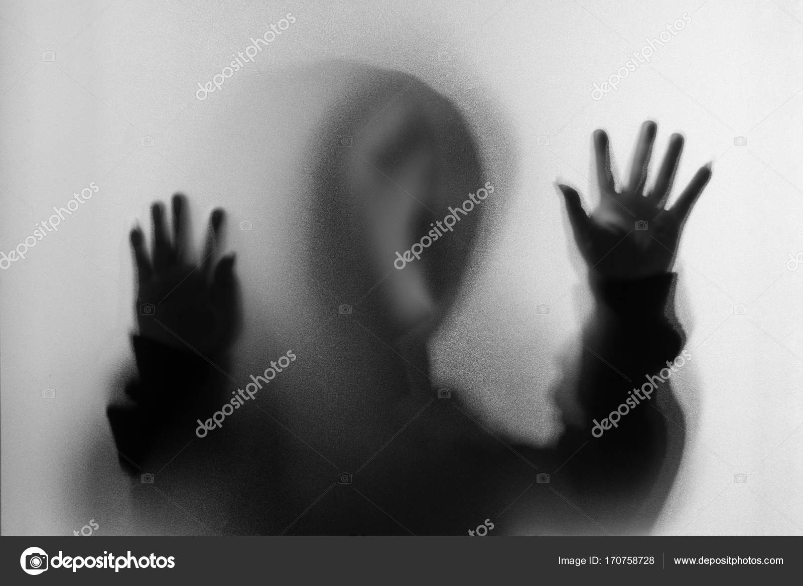 Shadow blur of horror man in screaming mask and hand touches the ...