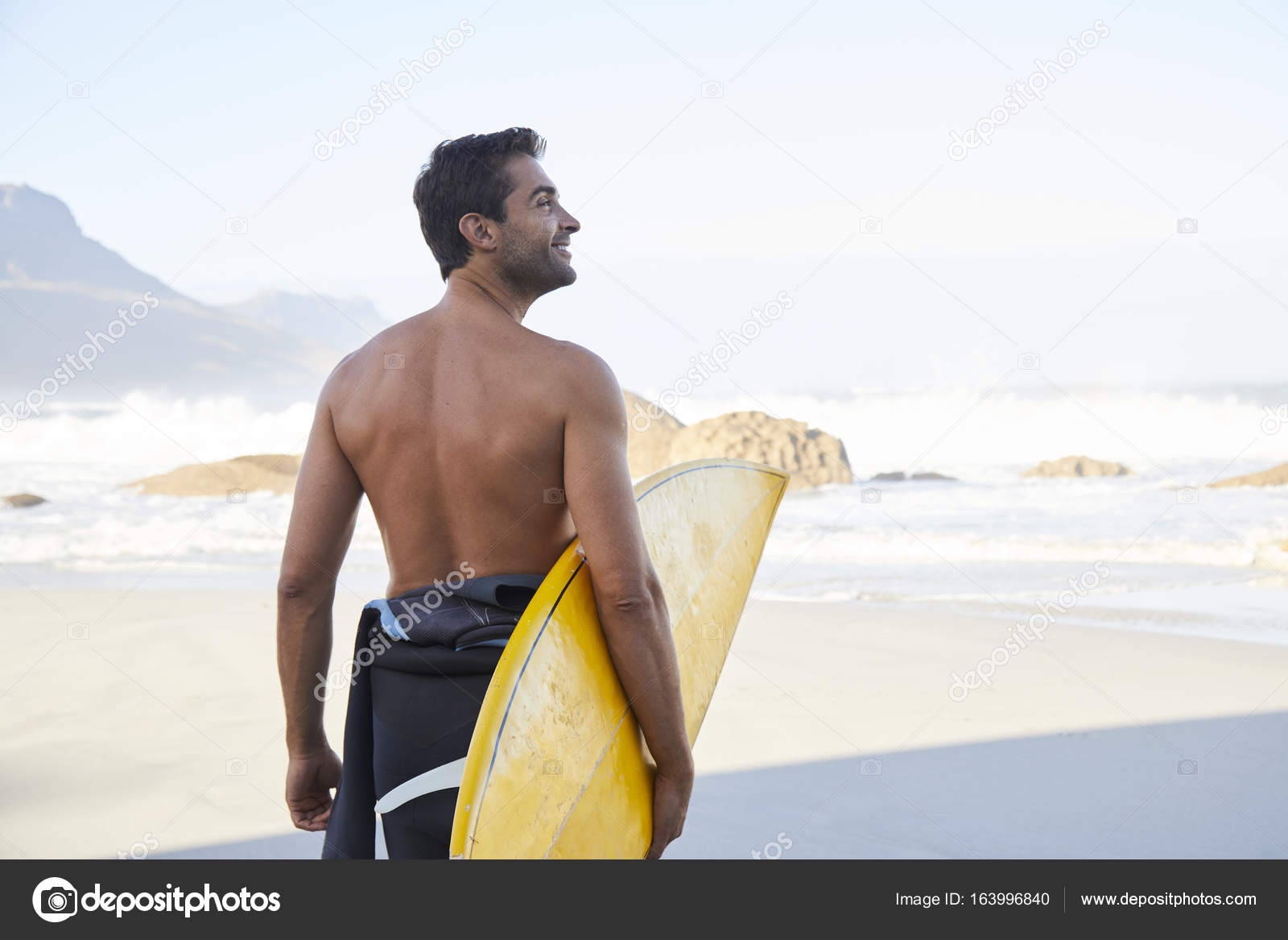 Surfer guy with board Stock Photo by ©sanneberg 163996840