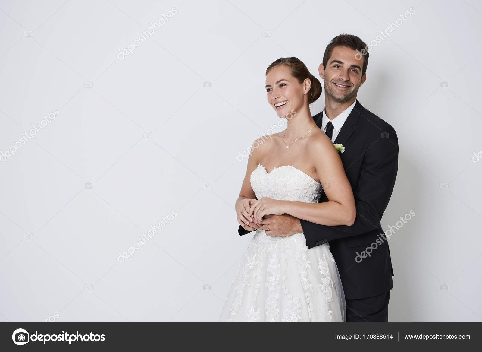 Groom hugging smiling bride Stock Photo by ©sanneberg 170888614