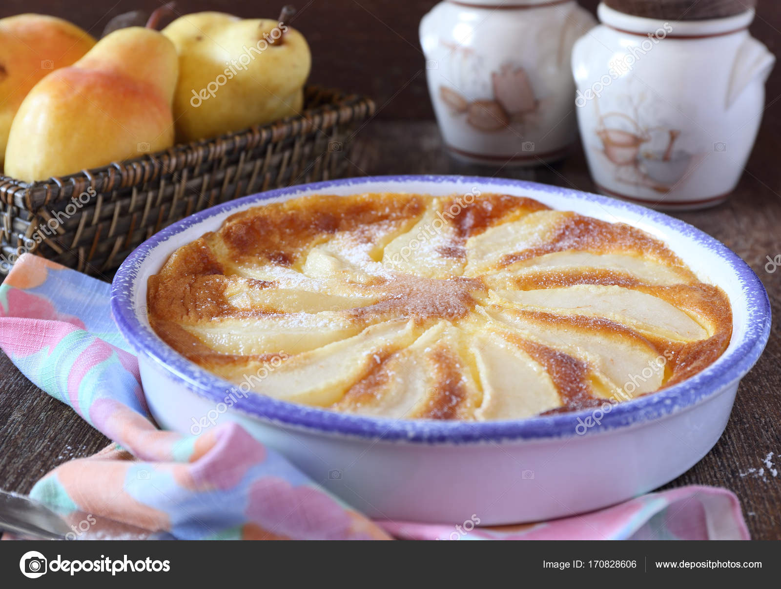 Pear clafoutis and and yellow pears in wicker basket — Stock Photo ...