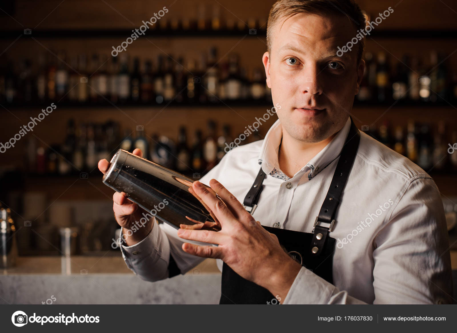 Bartender making a cocktail using a shaker Stock Photo by ©Fesenko ...