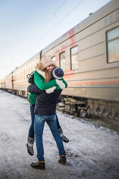 Couple meet each other after long time at railway station near train - Stock Image - Everypixel