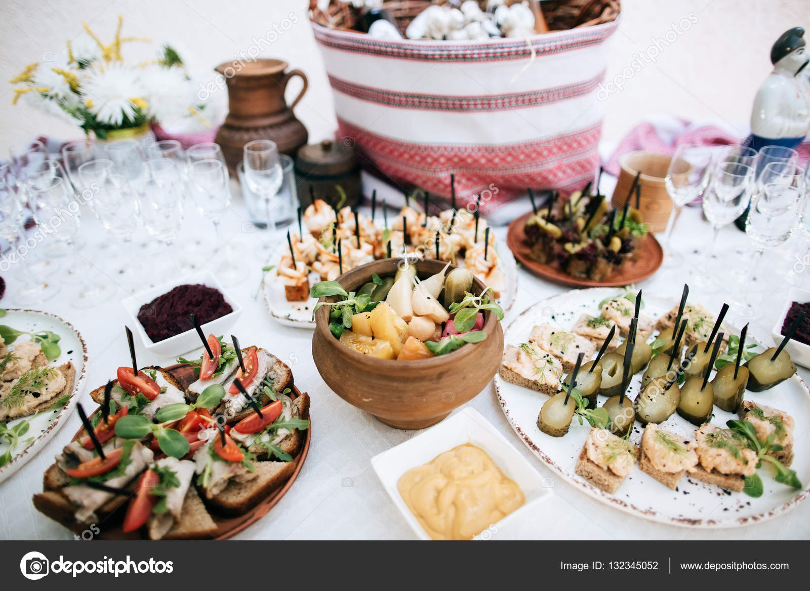Buffet table with alcohol and snacks Stock Photo by ©beorm 132345052