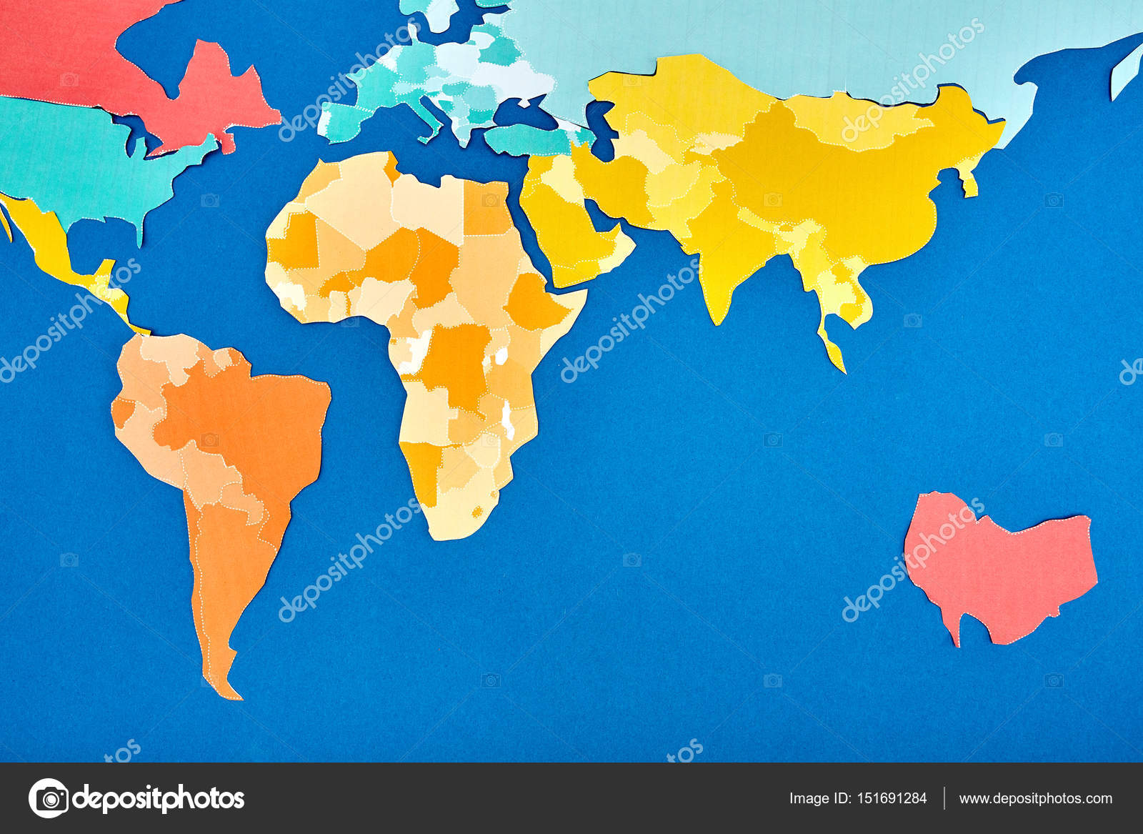 World map cut out of colored paper based on blue. — Stock Photo ...