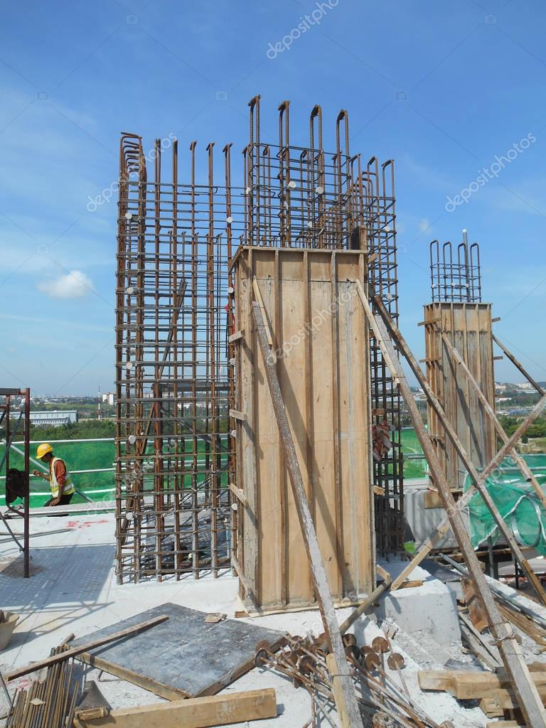Column timber form work and reinforcement bar at the construction site ...