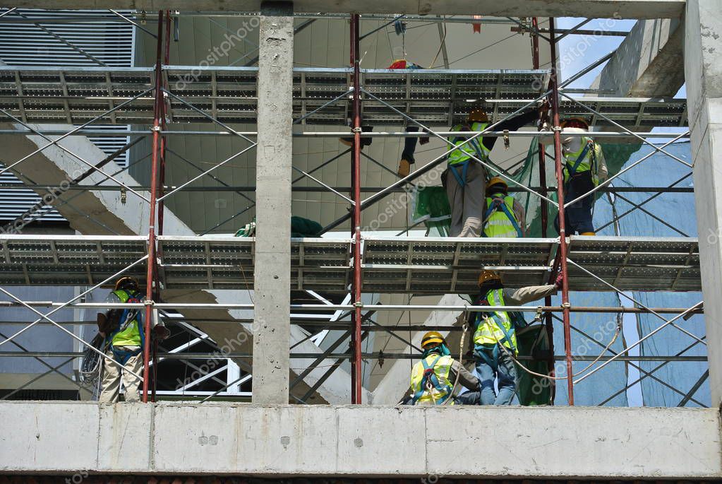 Construction workers working at high level – Stock Editorial Photo ...
