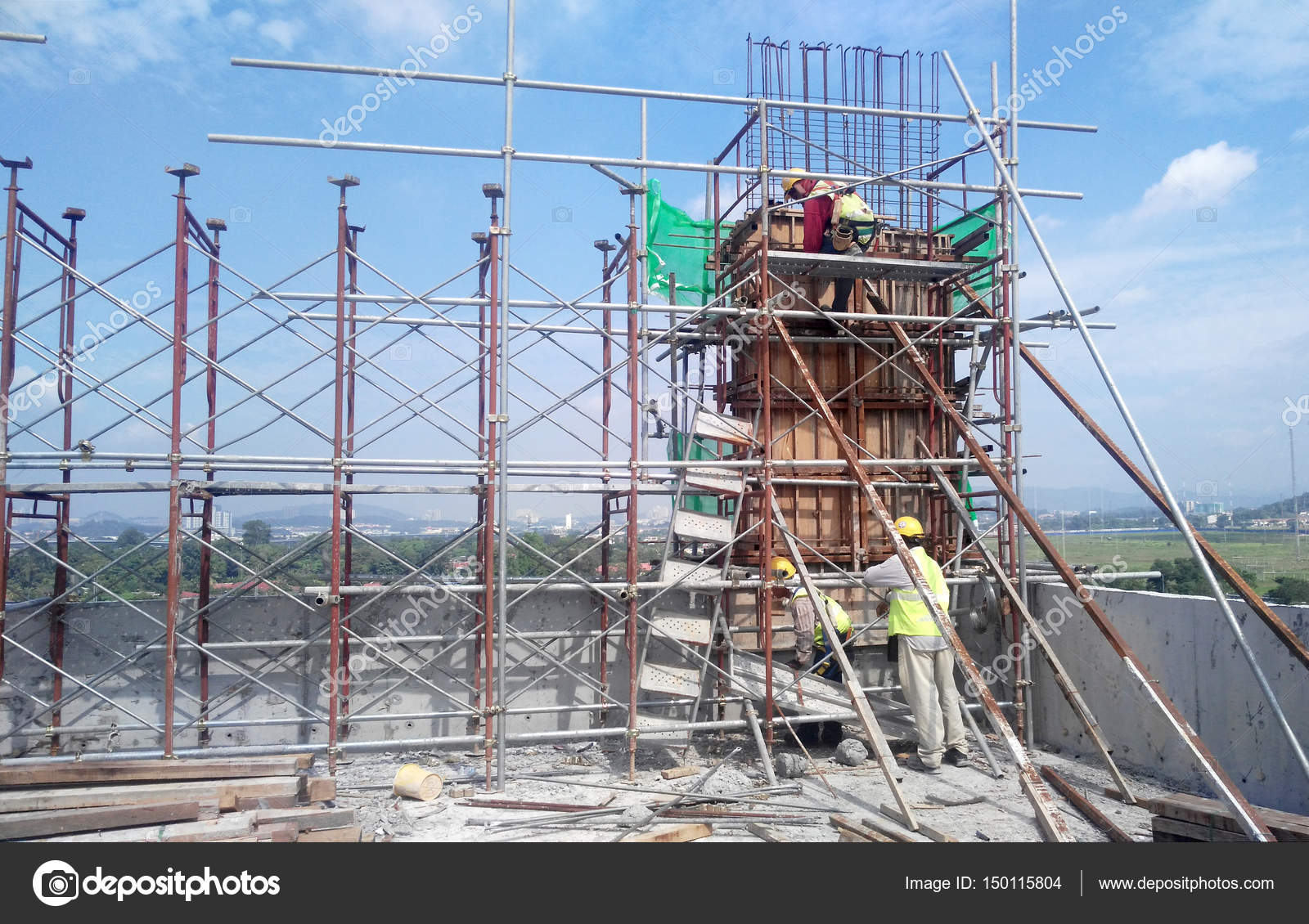 Construction workers working at height at the construction site ...