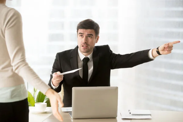 Manager asking bad worker to get out from office - Stock Image - Everypixel