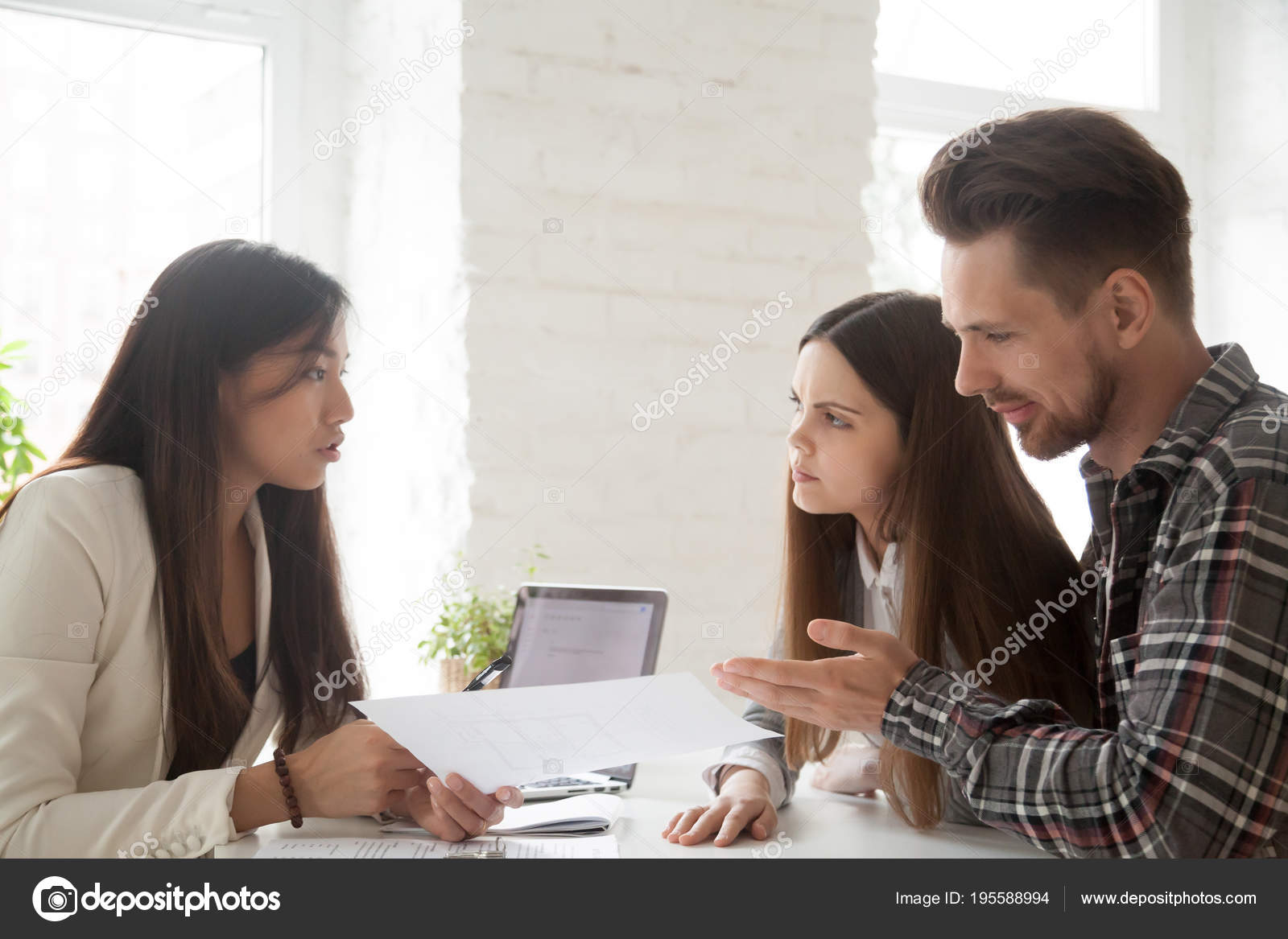 Asian lawyer consulting unconvinced deceived clients complaining ...