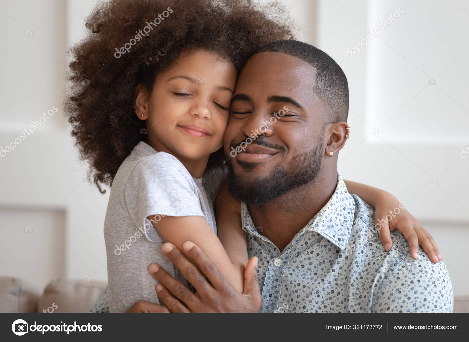Happy african American dad and daughter cuddle touching cheeks — Stock ...