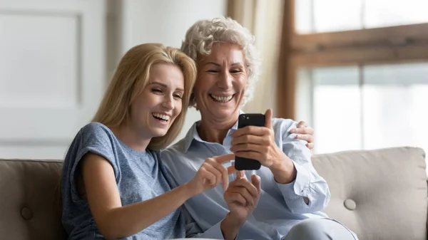 Happy two generations family making selfie on cellphone. - Stock Image ...