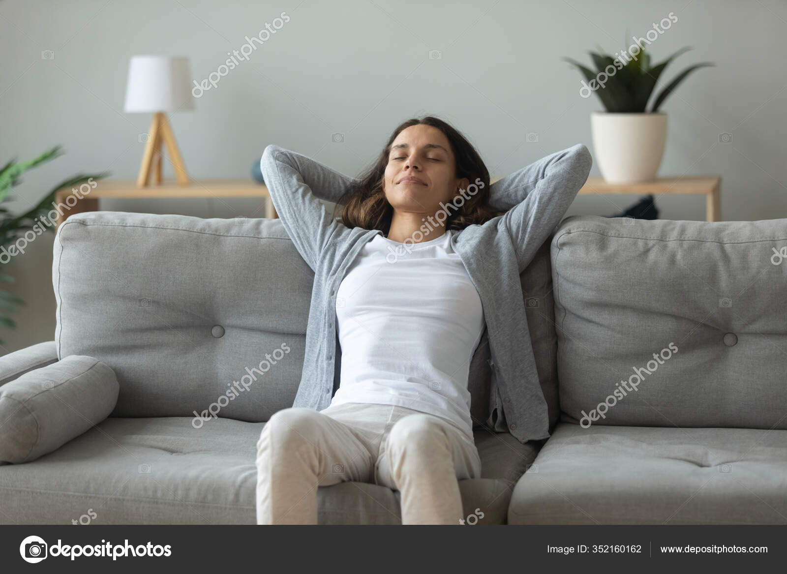 Young woman relax on comfortable sofa breathing fresh air — Stock Photo ...