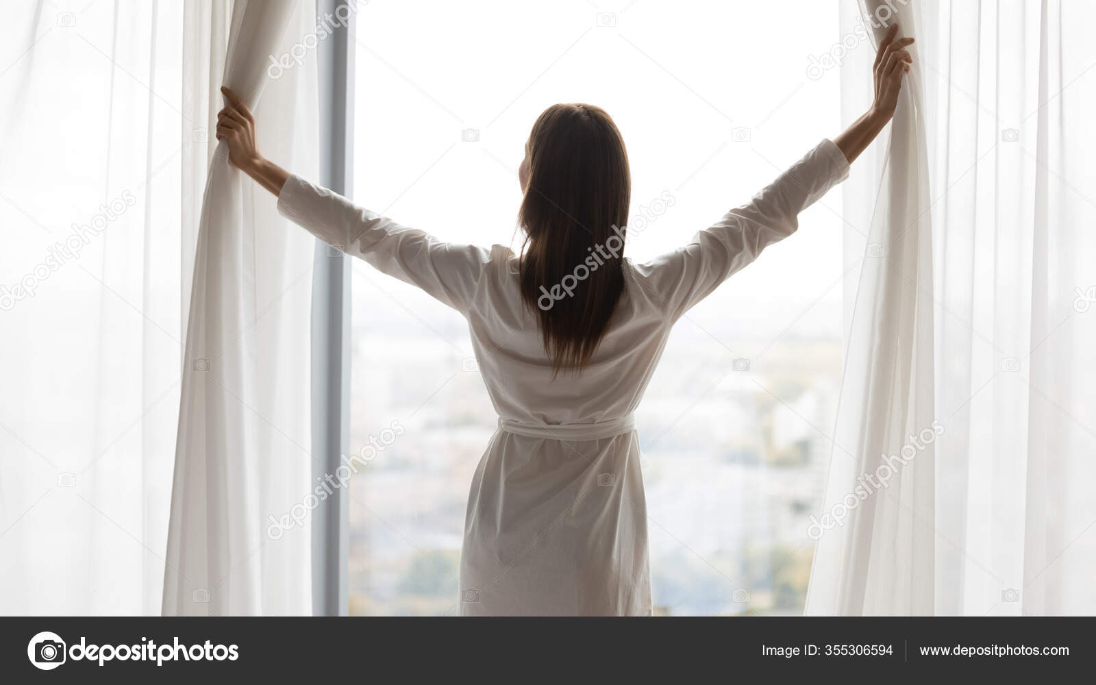 Woman in night robe gown pulling opening lace curtains. Stock Photo by ...