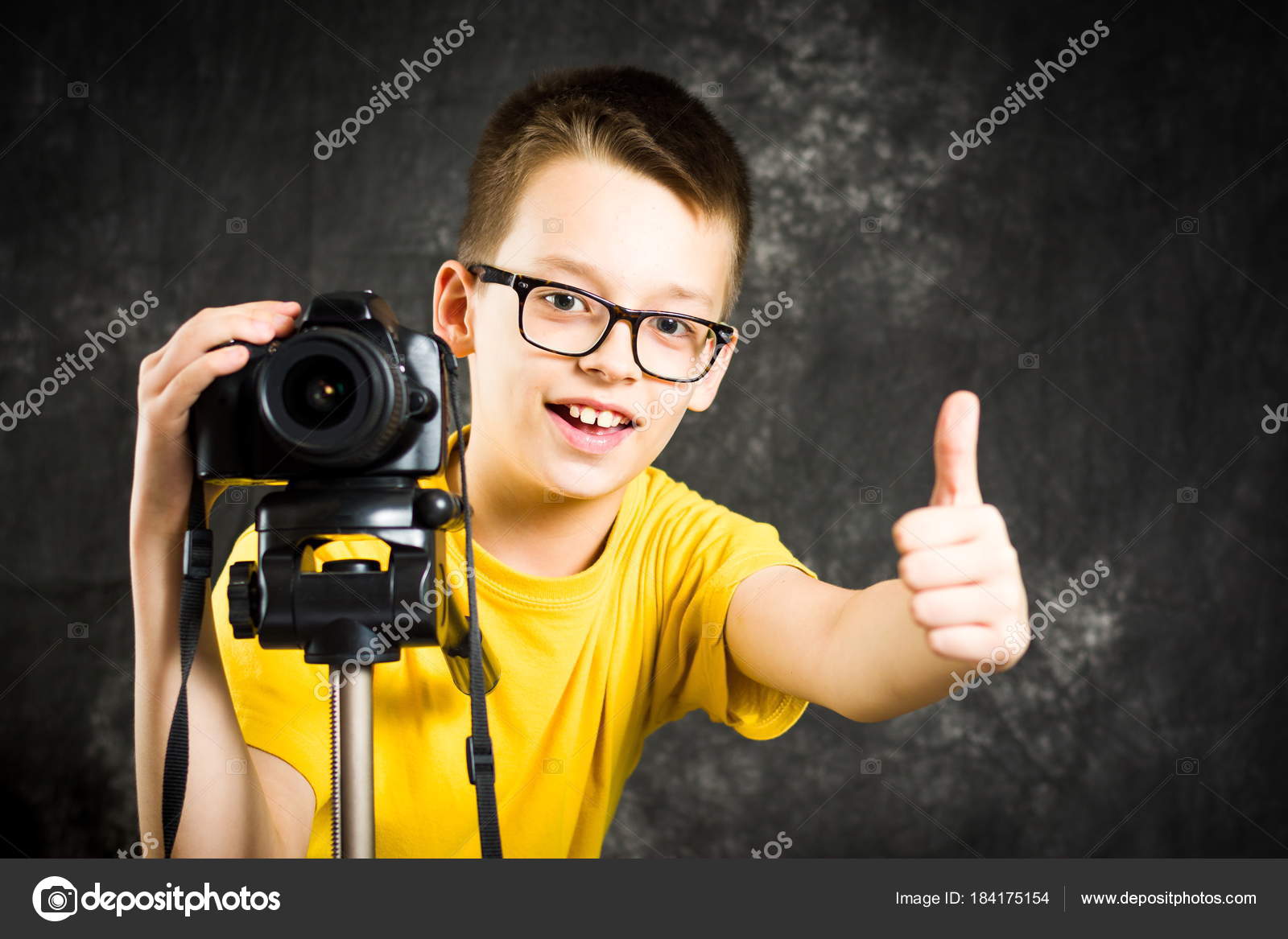 Teenage boy using big digital camera — Stock Photo © CreativeFamily ...
