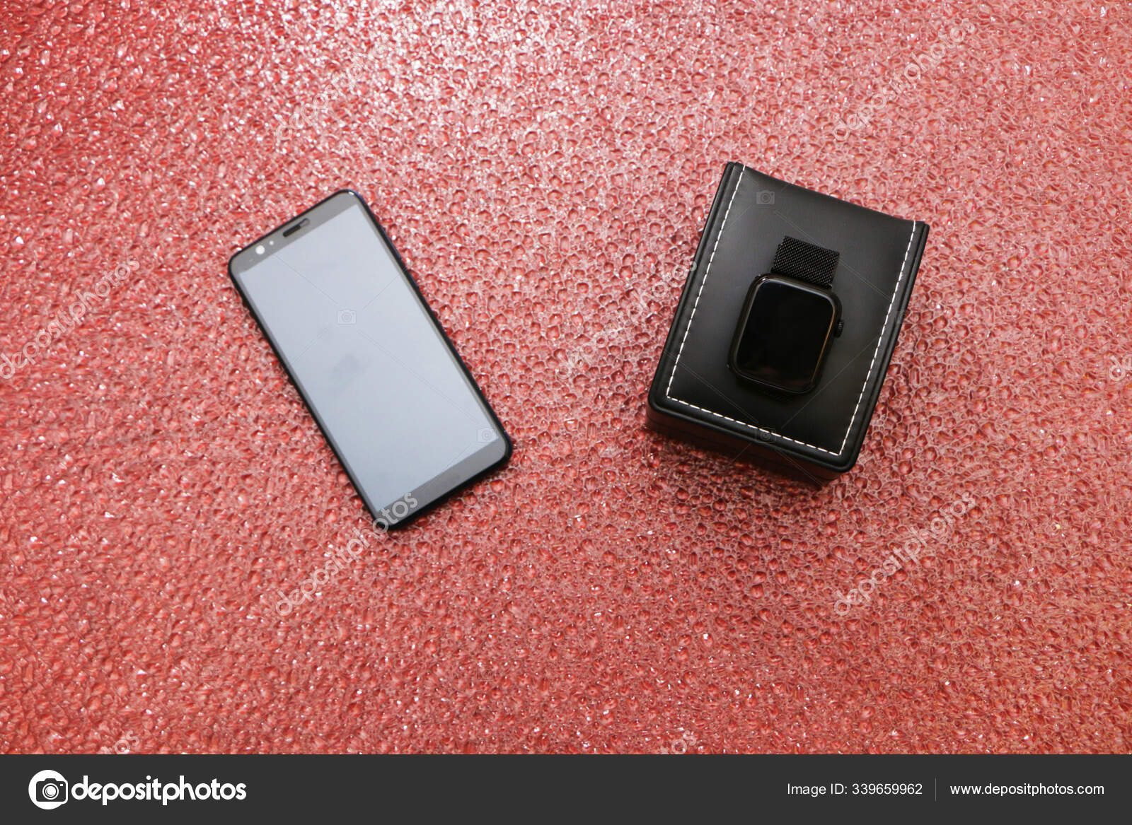 Smartphone and smartwatch in a black gift box — Stock Photo © Toberto ...