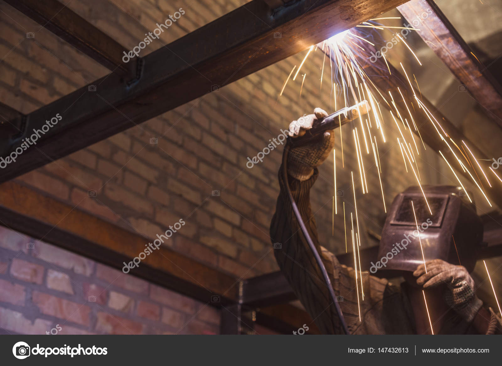 Welding machine. The man works as a welding machine Stock Photo by ...