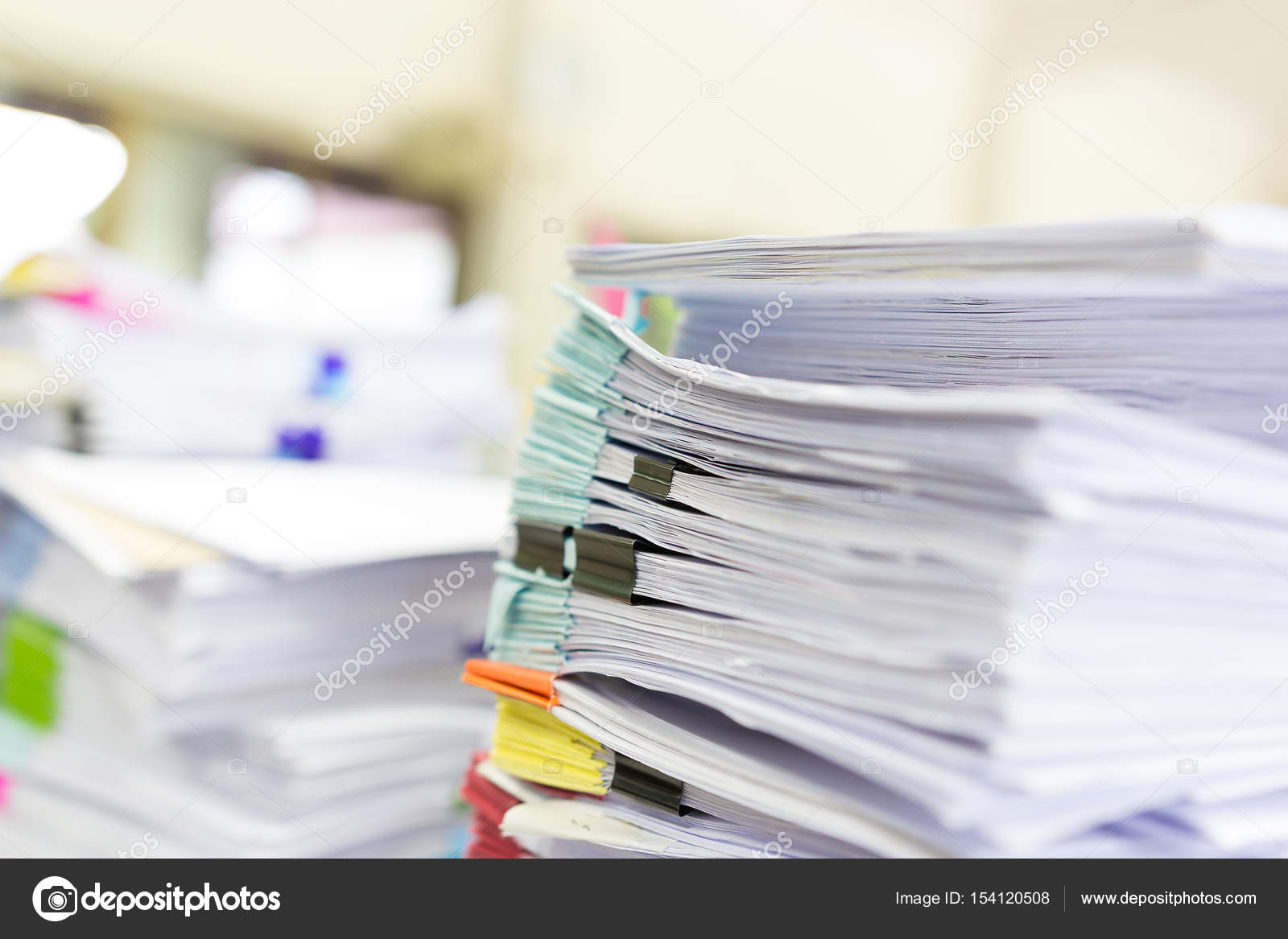Pile of unfinished documents on office desk, Stack of business paper ...