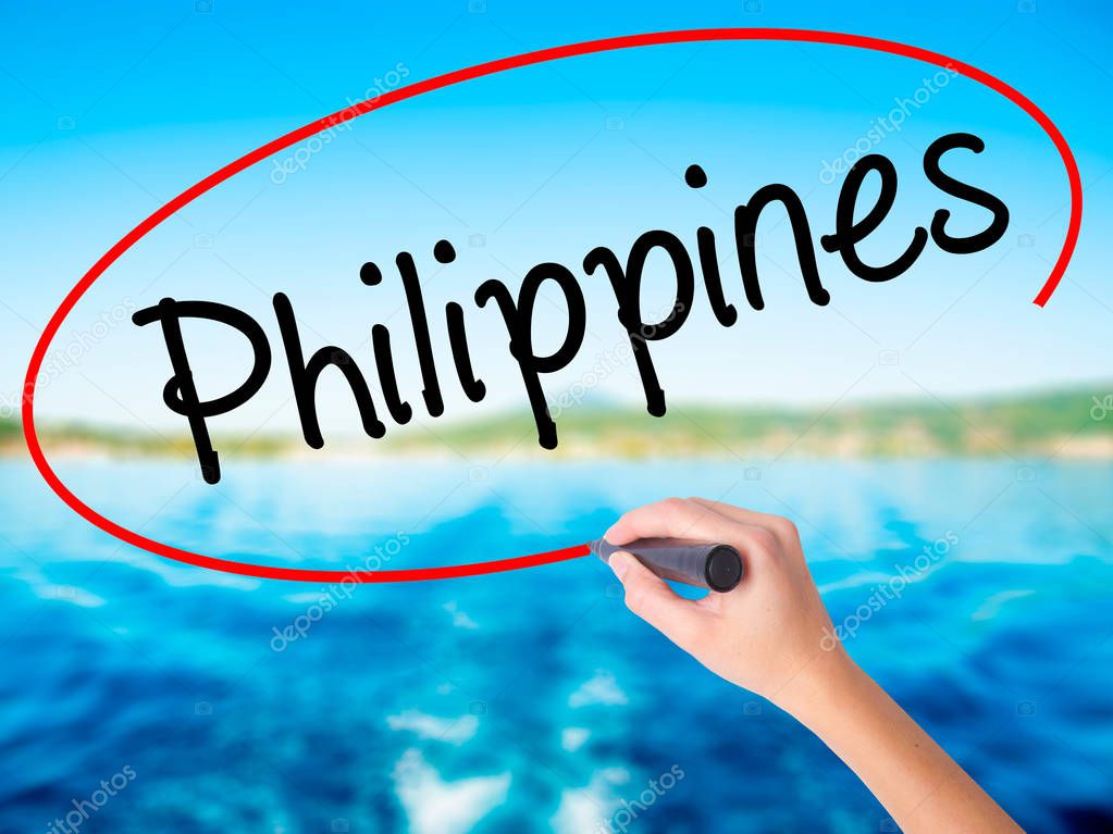 Woman Hand Writing Philippines with a marker over transparent bo ...
