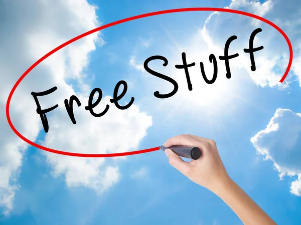 Woman Hand Writing Free Stuff with black marker on visual screen ...