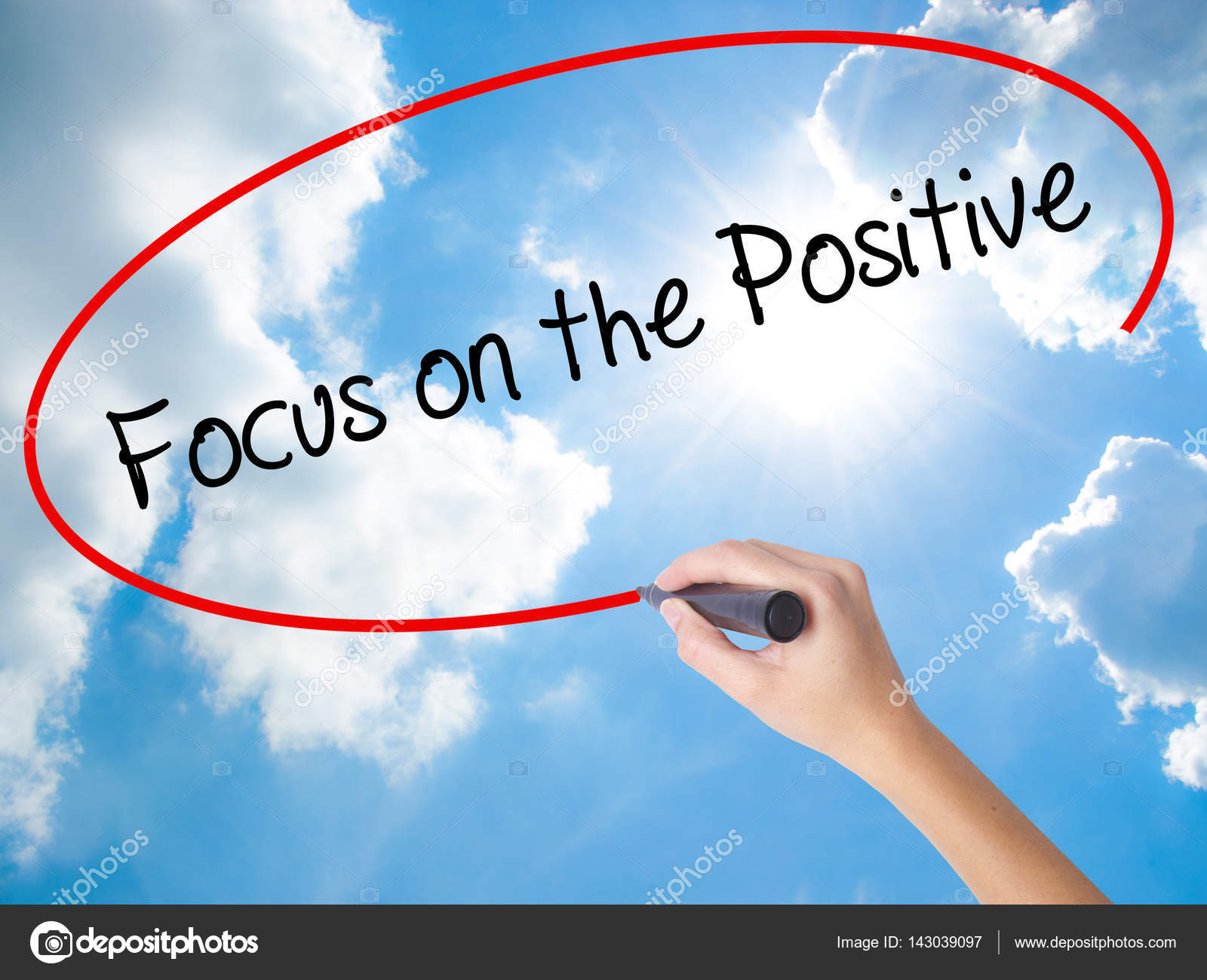 Woman Hand Writing Focus on the Positive with black marker on vi ...