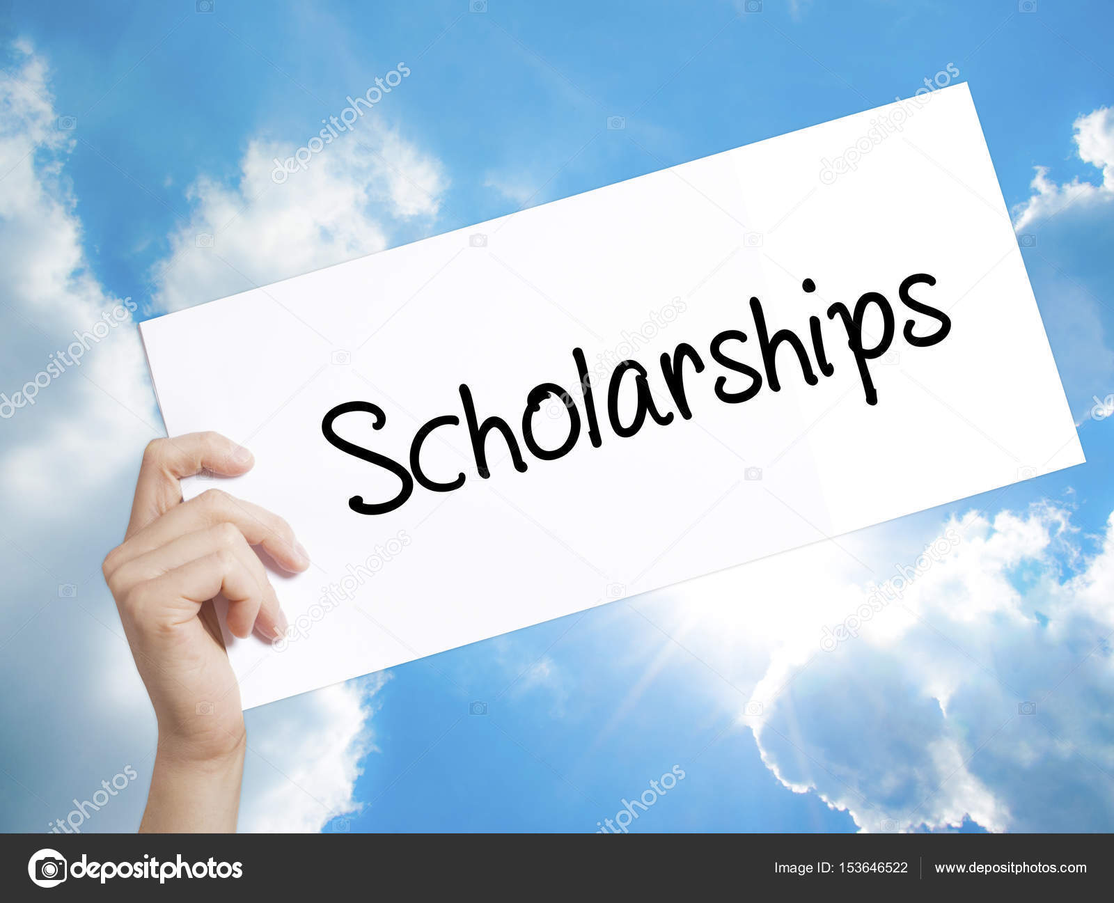 Scholarships Sign on white paper. Man Hand Holding Paper with te ...