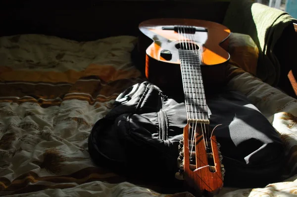 Classical guitar. Issuing a stringed instrument sounds. Fretboard ...