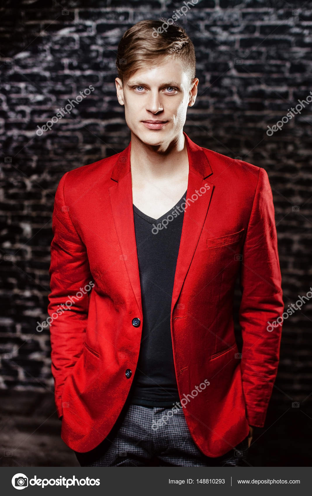 The guy is a model in a red jacket. Beautiful brown-haired man on a ...