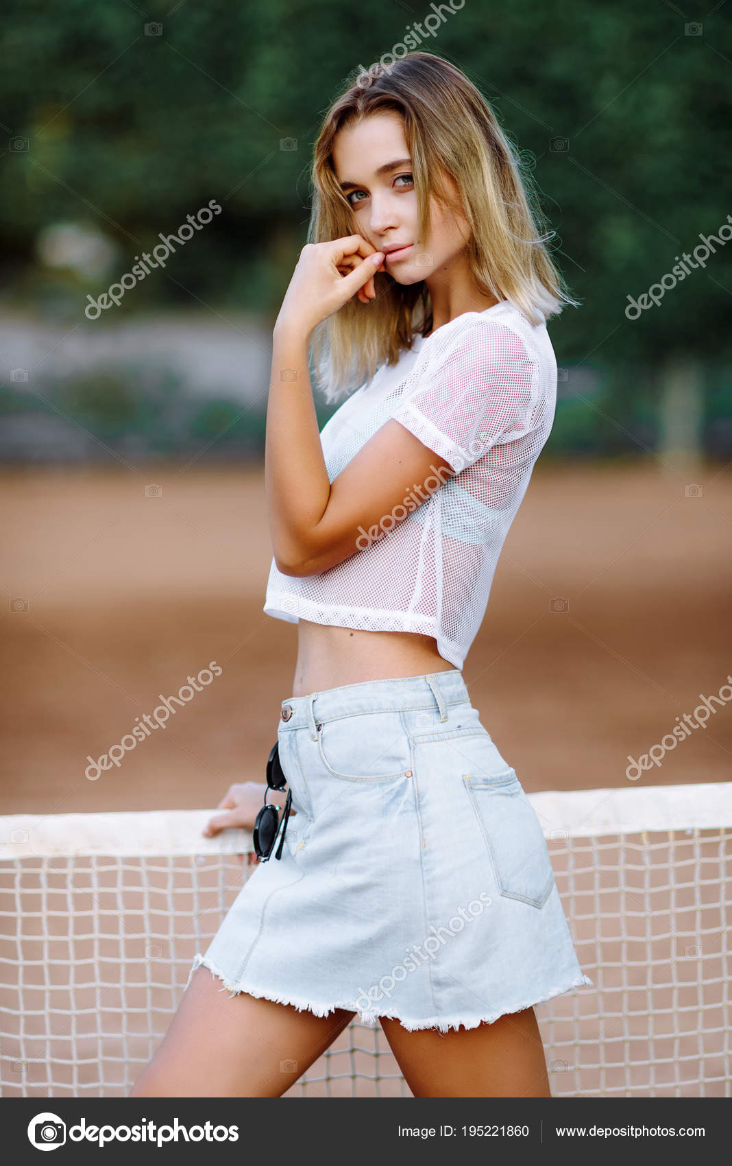 Sport model posing on a tennis court. Sexy tennis girl Stock Photo by ...