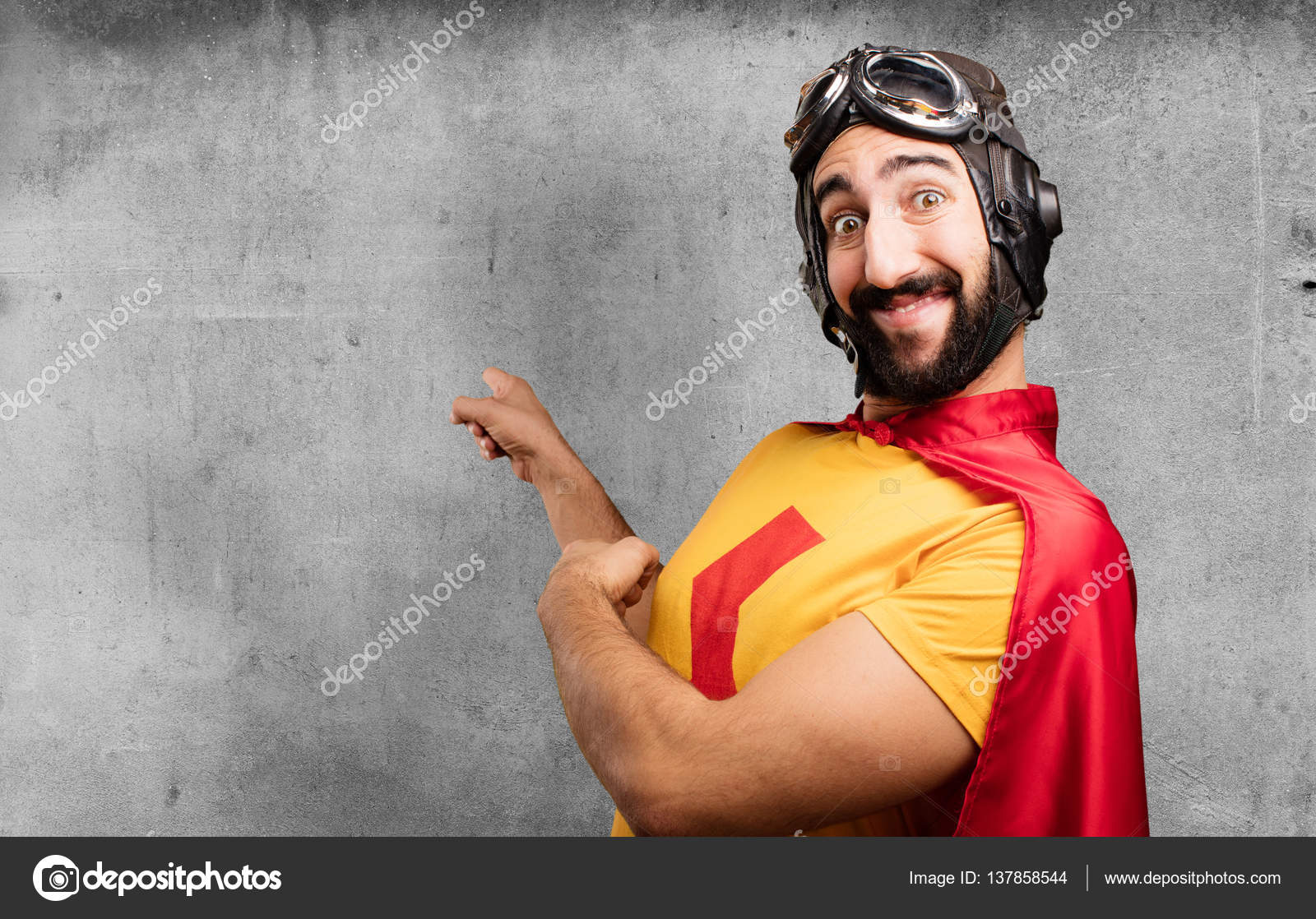 Crazy super hero showing gesture Stock Photo by ©kues 137858544